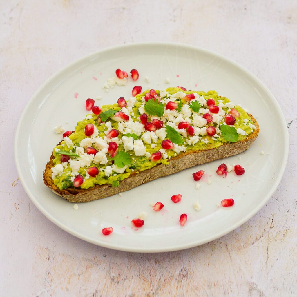 Avocado Toast with Feta and Pomegranate Seeds - Easy Peasy Foodie